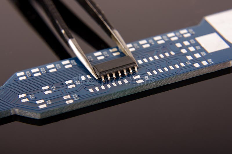 Tiny Integrated Circuit on Empty PCB Board Stock Image - Image of ...