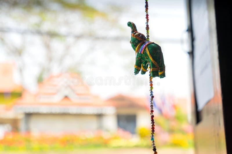 Small Elephant Toy Hang at Coffee Shop Stock Image - Image of outside ...