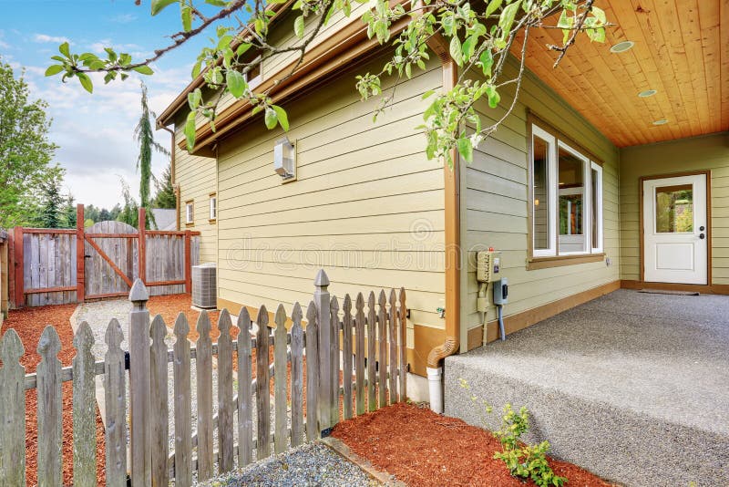 Small Empty Covered Porch with View of Concrete Walkway Stock Photo ...