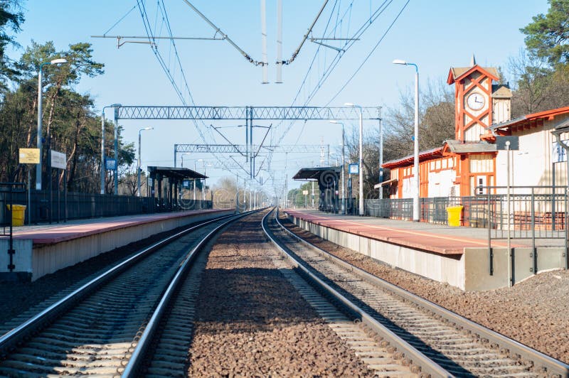 A Small Empty Railway Station, Iron Track Going into the Distance ...
