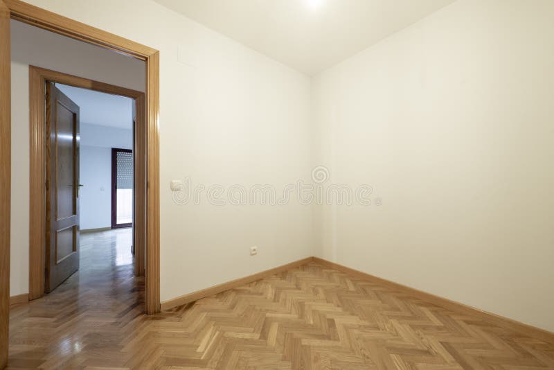 Small Empty Room with Plain Off-white Painted Walls, Herringbone-shaped ...