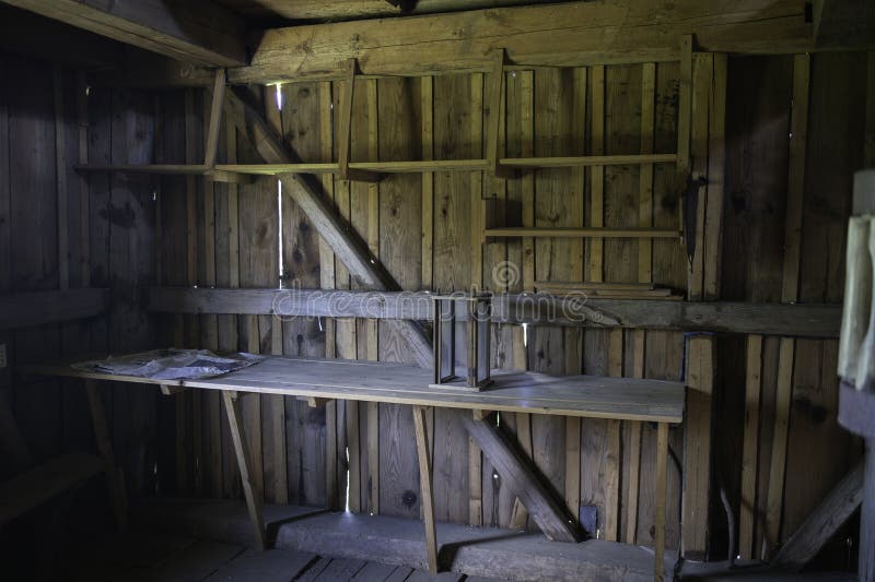 A Small, Empty Room with a Wooden Shelf and a Table Stock Photo - Image ...