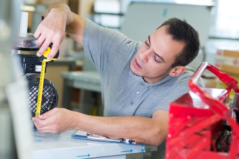 Small Engine Technician Measuring Stock Image - Image of motorcycle ...