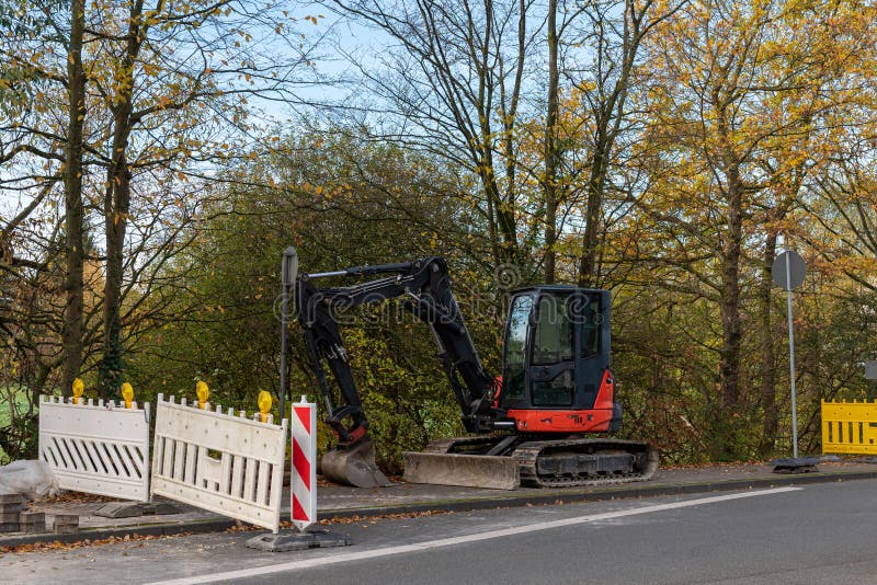 Small Excavator Stand on the Side of the Road. Stock Image - Image of ...