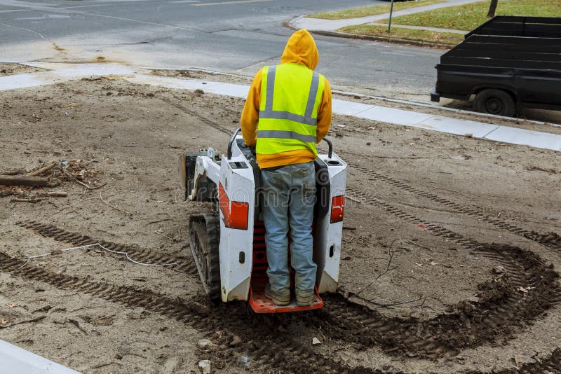 A Small Excavator Works on the Street in the Summer Editorial ...