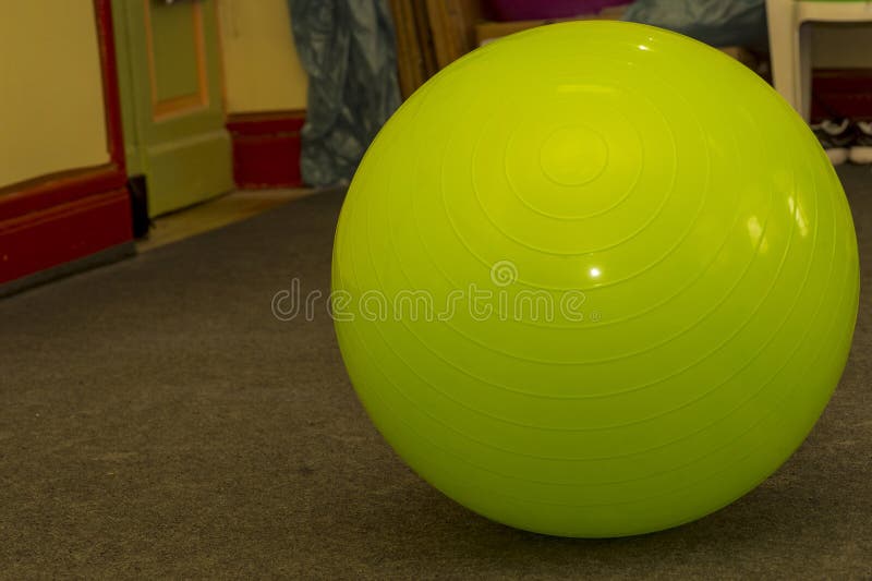 Exercise Room . Visible Green Rubber Exercise Ball. Stock Image - Image ...