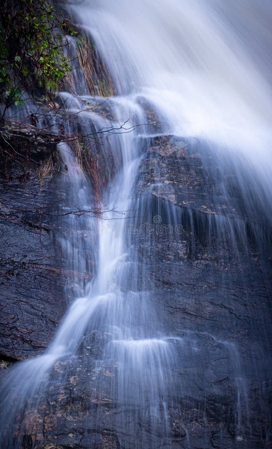 Small Falls and Tiny Water Trails Next To Looking Glass Falls Stock ...