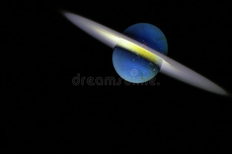 Small Figure of Neptune with a Ring Against a Dark Background Stock ...