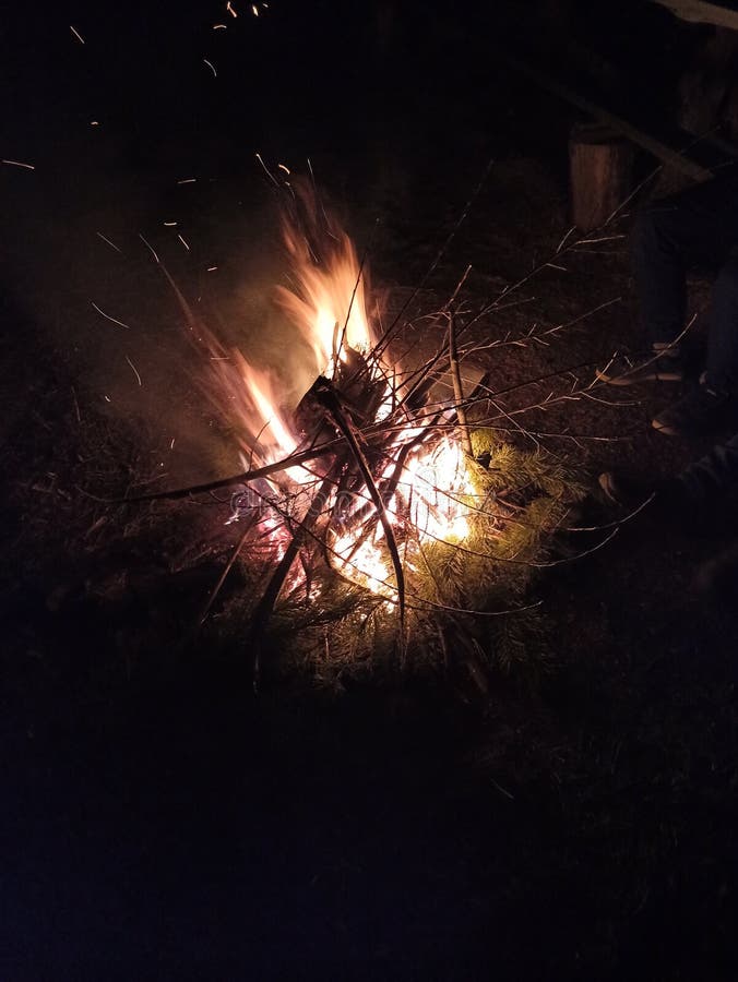 A Small Fire on the Asphalt. Lighting of Bonfires. Smoke from the Fire ...