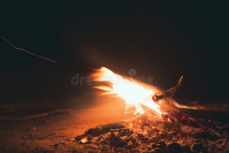 A small fire is burning stock image. Image of background - 262472583