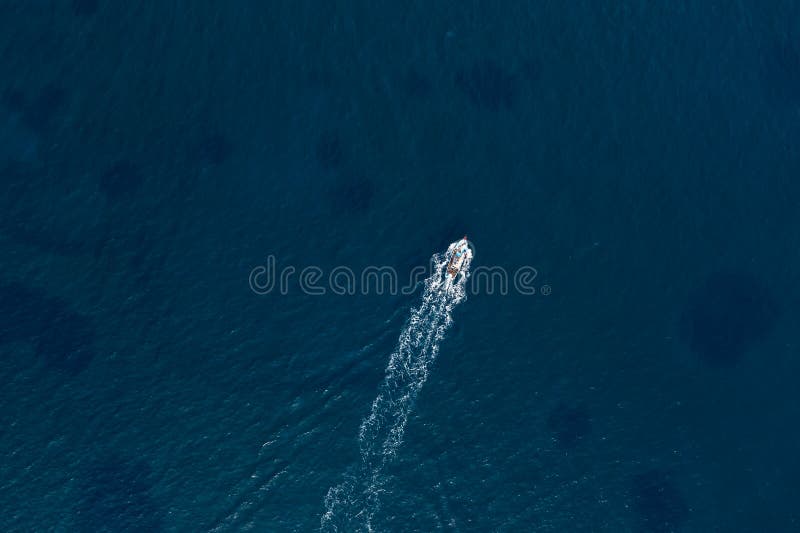 Small Fishing Boat in the Deep Blue Sea. Overhead View Stock Image ...
