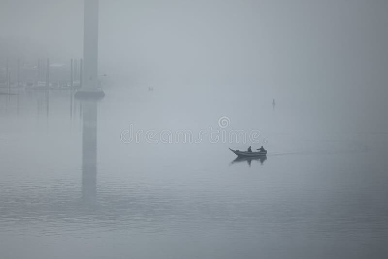 Small Fishing Boat in Douro River Hardly Visible in the Mist Stock ...