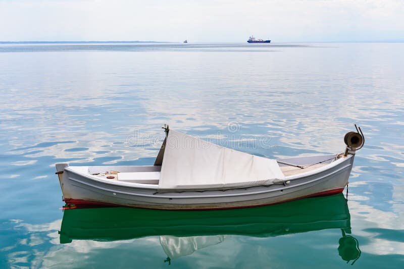 Small Fishing Boat at Sea Surface Stock Image - Image of vessel, water ...