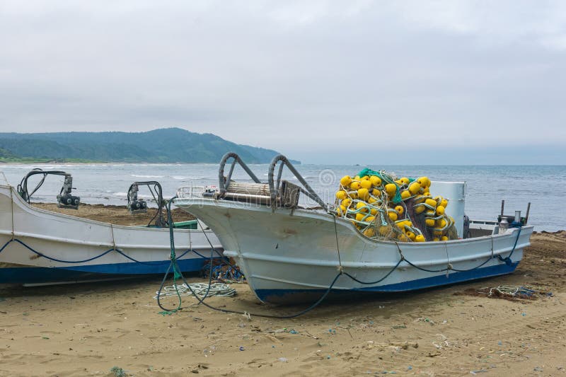Small Fishing Boats with a Net on Board on the Seashore Stock Image ...