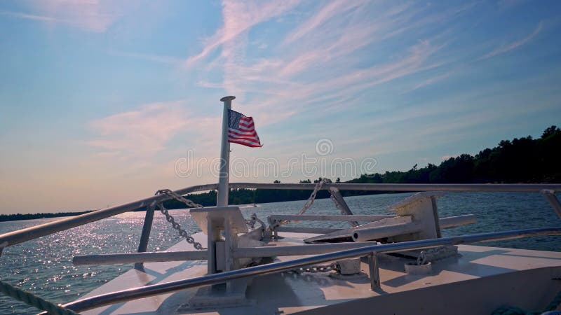 A Small Flag Develops on the Bow of the Boat Floating on the River ...