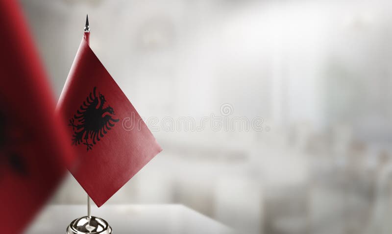 Small Flags of the Albania on an Abstract Blurry Background Stock Image ...