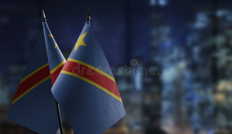 Small Flags of the Democratic Republic of the Congo on an Abstract ...