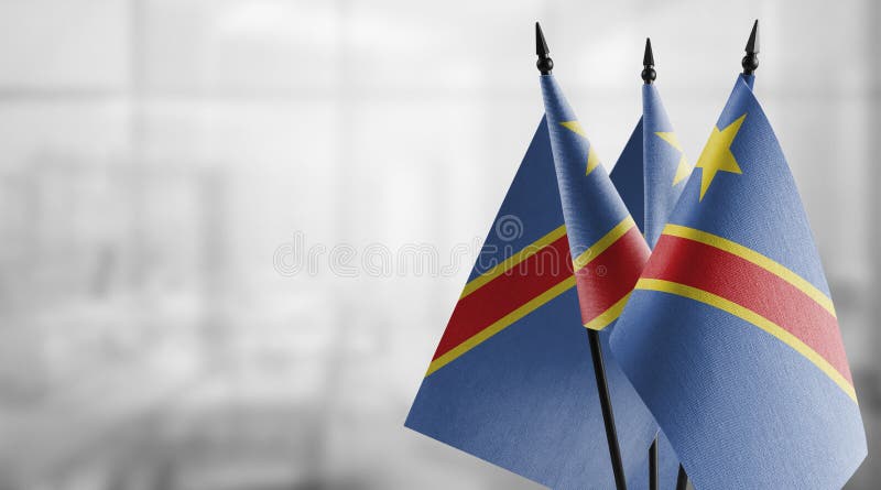 Small Flags of the Democratic Republic of the Congo on an Abstract ...