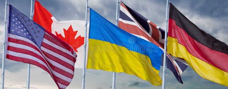 Small Flags of Different Countries on Table. Flags of Canada, American ...