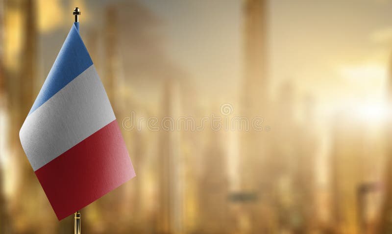 Small Flags of the France on an Abstract Blurry Background Stock Image ...
