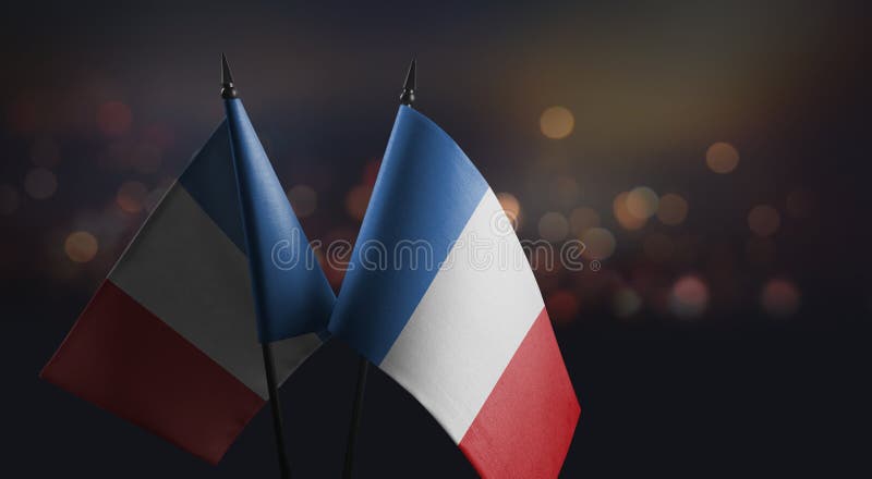 Small Flags of the France on an Abstract Blurry Background Stock Image ...