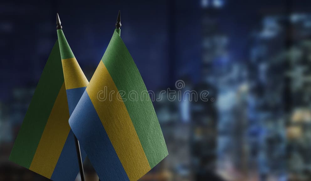 Small Flags of the Gabon on an Abstract Blurry Background Stock Image ...