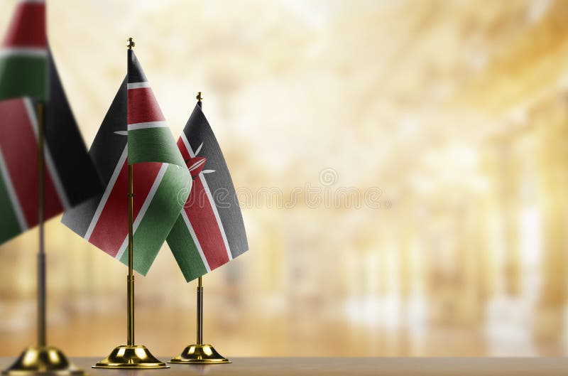 Small Flags of the Kenya on an Abstract Blurry Background Stock Photo ...