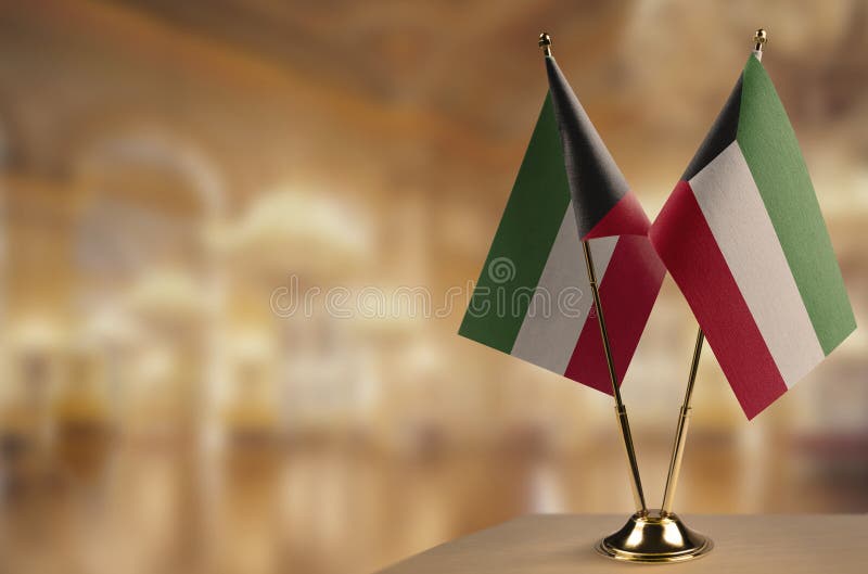 Small Flags of the Kuwait on an Abstract Blurry Background Stock Photo ...