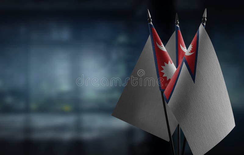 Small Flags of the Nepal on an Abstract Blurry Background Stock Photo ...
