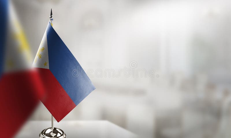 Small Flags of the Philippines on an Abstract Blurry Background Stock ...