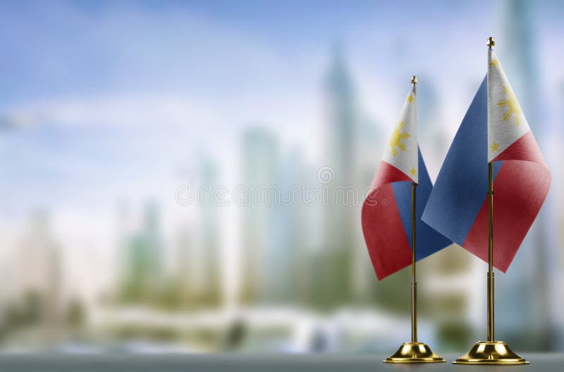 Small Flags of the Philippines on an Abstract Blurry Background Stock ...