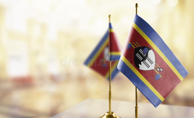 Small Flags of the Swaziland on an Abstract Blurry Background Stock ...