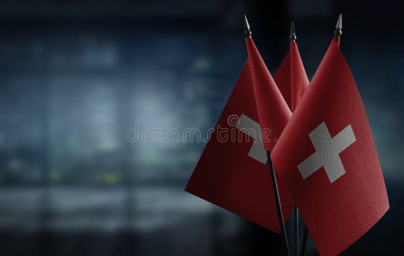 Small Flags of the Switzerland on an Abstract Blurry Background Stock ...