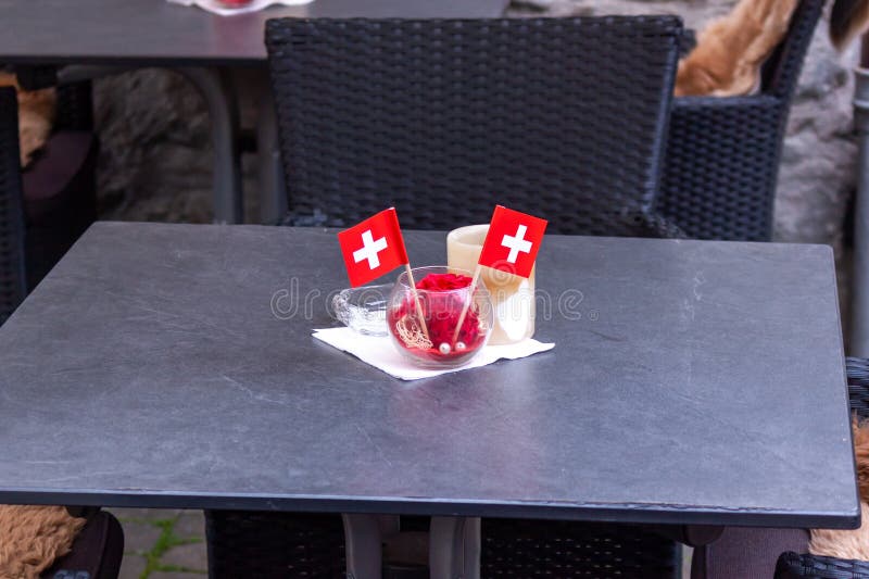 Small Flags of Switzerland in a Vase on the Table Stock Photo - Image ...