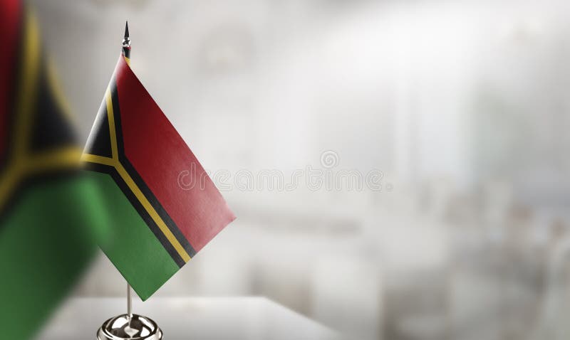 Small Flags of the Vanuatu on an Abstract Blurry Background Stock ...