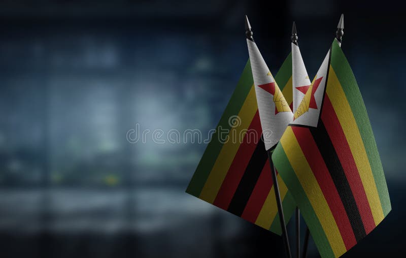 Small Flags of the Zimbabwe on an Abstract Blurry Background Stock ...