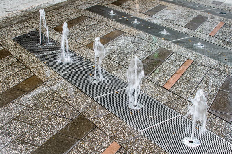 Fountain From The Floor Of The Street On The Sunset With Golden Stock ...