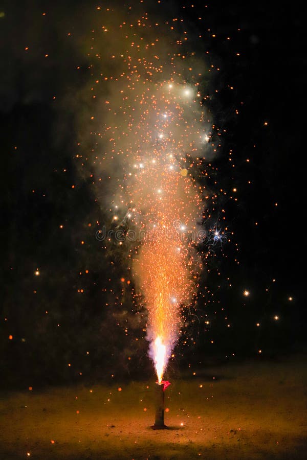 Small Fountain of Lit Firecrackers Releasing Colored Ignited Gunpowder ...