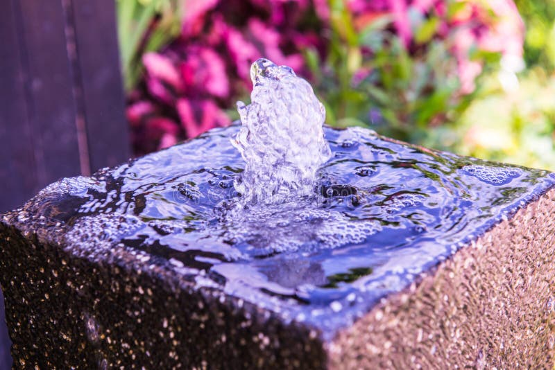 Small fountain in the park stock photo. Image of garden - 190219658