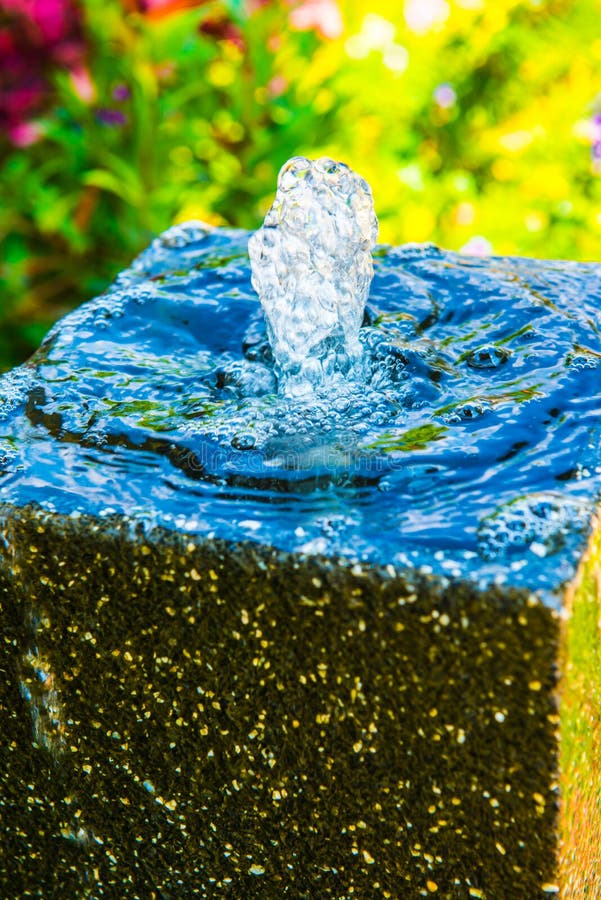 Small fountain in the park stock image. Image of motion - 246452843