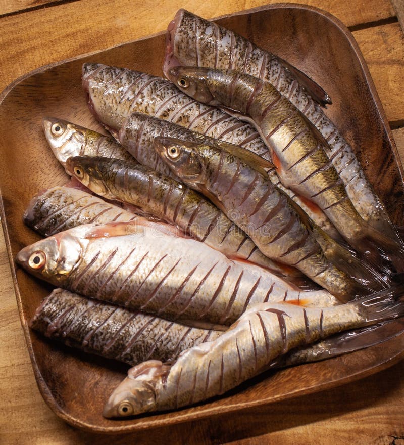 Small Fresh Fish Chub on a Wooden Plate on the Wooden Box. Top View ...