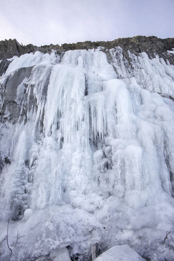 Small Frozen Waterfall on Rocky Mountain Side Stock Image - Image of ...