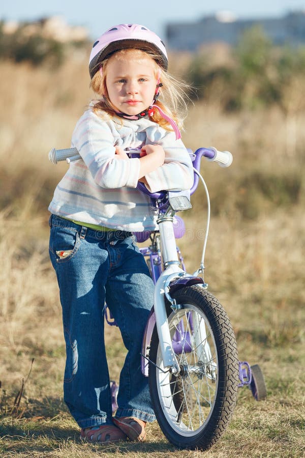 Small funny kid with bike stock image. Image of leaning - 44822423