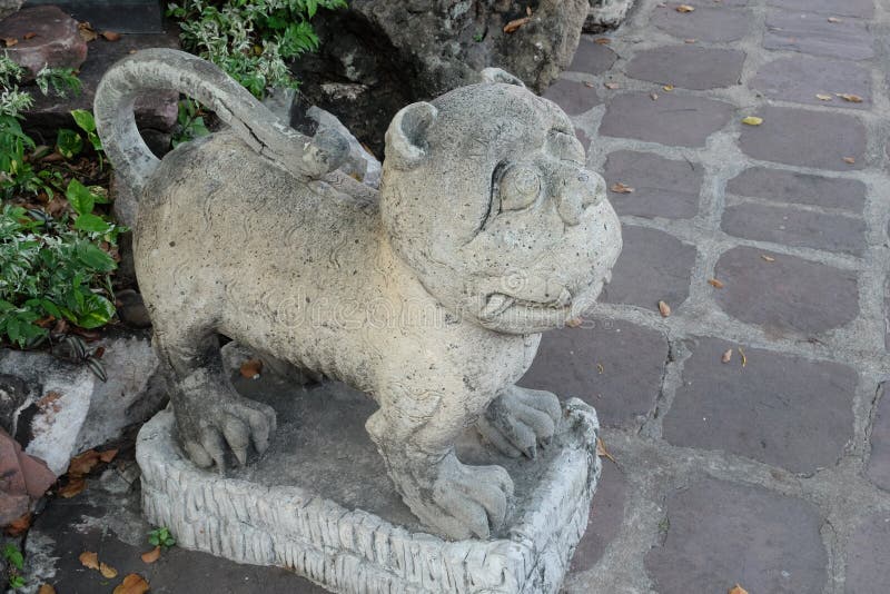 A Small Garden Sculpture of a Four-legged Mythical Creature Stock Image ...