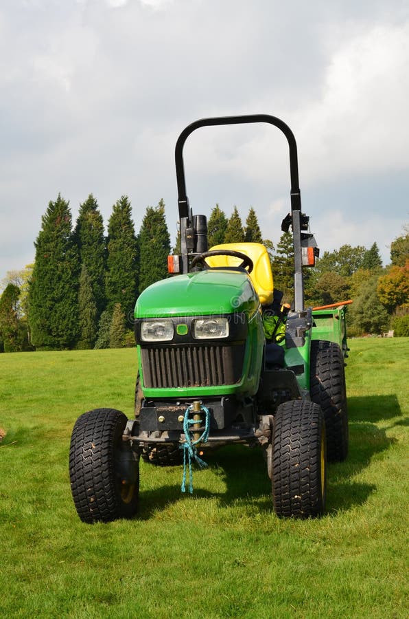 Small Garden Tractor on Public Land. Stock Photo - Image of small ...