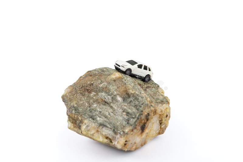 Small Generic Suv Model Car Climbing a Rock in Balance Isolated on ...
