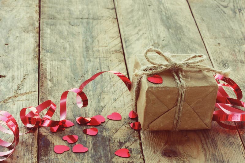 Small gift on old table stock photo. Image of holiday - 64073570