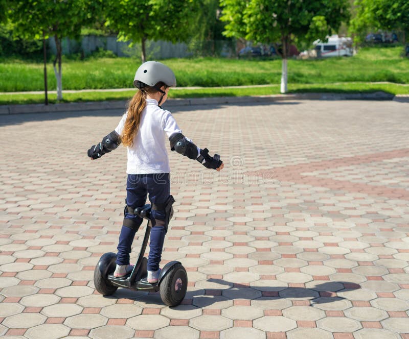 Small Girl Learns To Ride Electric Mini Hoverboard Stock Image - Image ...