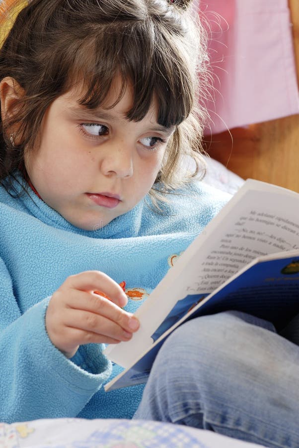 Small Girl reading stock photo. Image of learning, young - 1279442