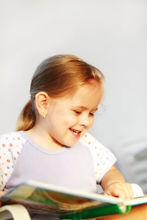 Small girl reading stock image. Image of knowledge, preschool - 3166029